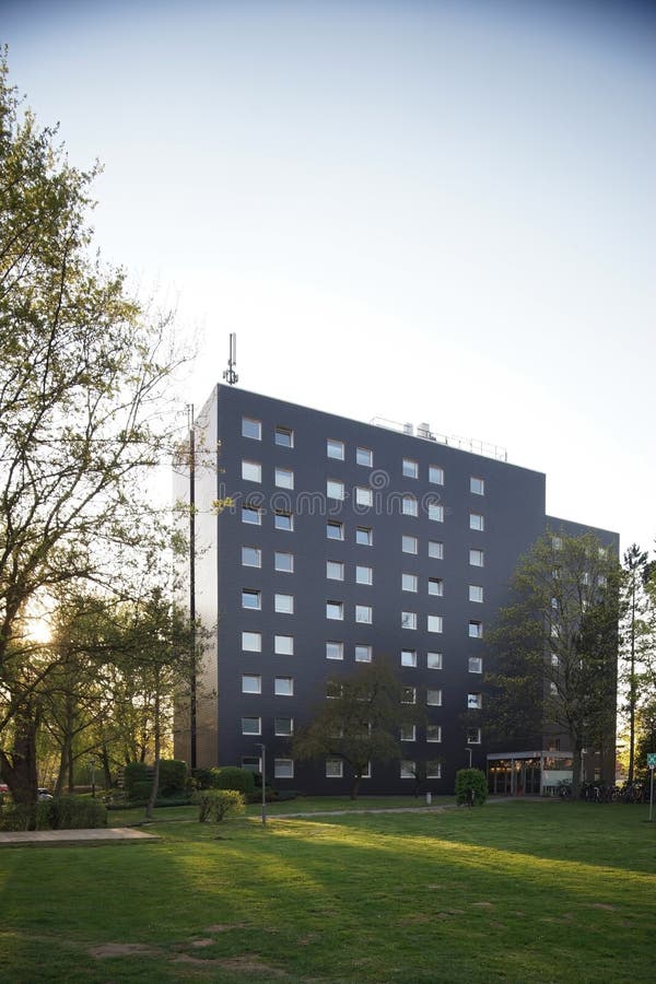 Modern Building with Square Windows, Facade in Dark Gray, with Sunset ...