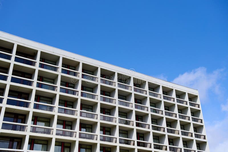 Modern Building with Square Windows Under a Clear Blue Sky during the ...