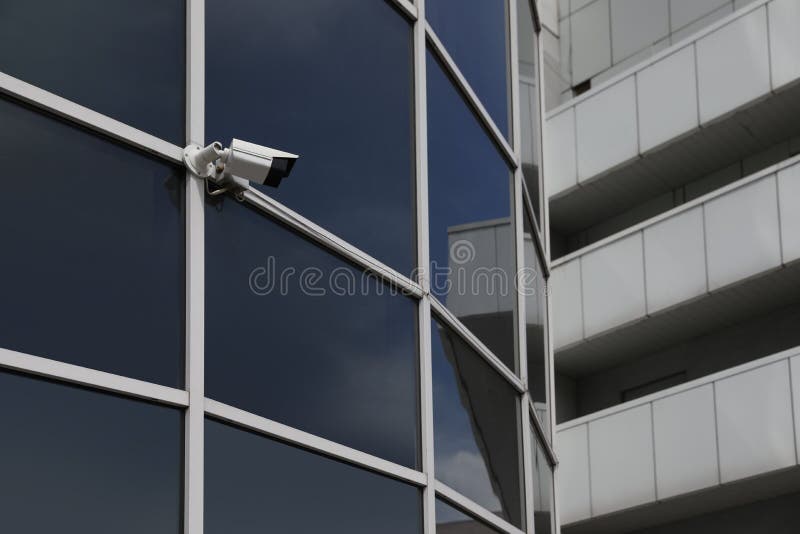 Modern Building with Tinted Windows and CCTV Camera, Low Angle View ...