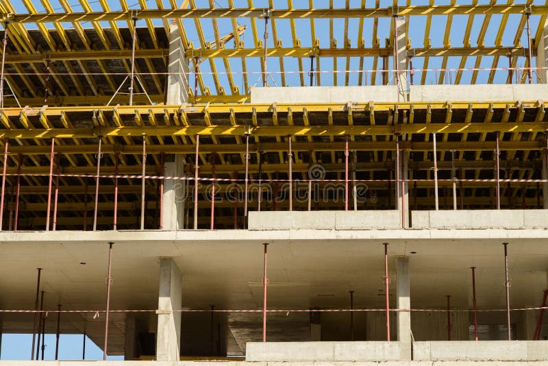 Modern Building Under Construction Featuring Concrete and Scaffolding ...