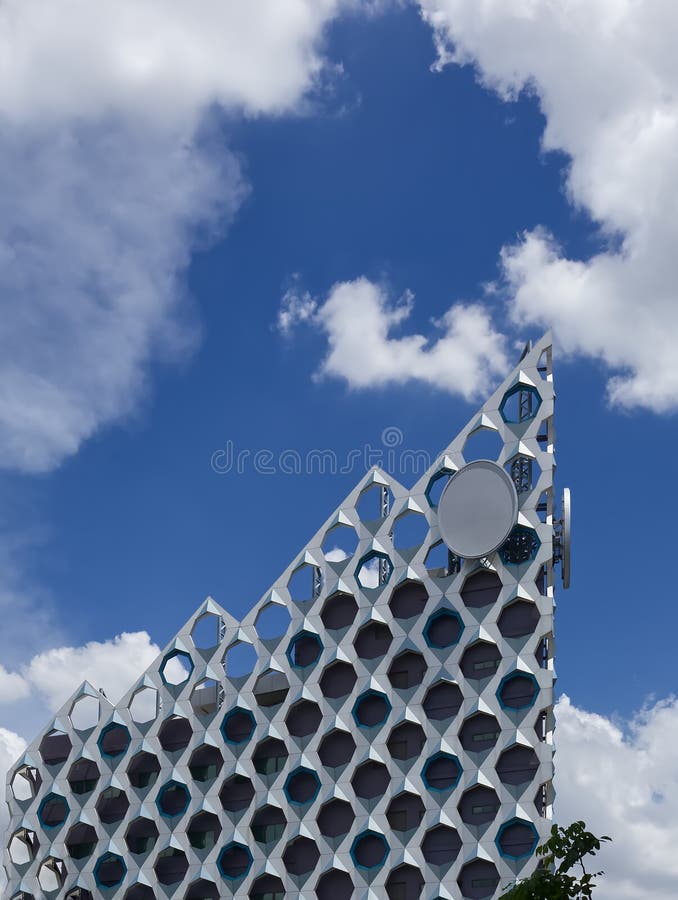 A Modern Building with a Unique Honeycomb Design and Hexagonal Windows ...