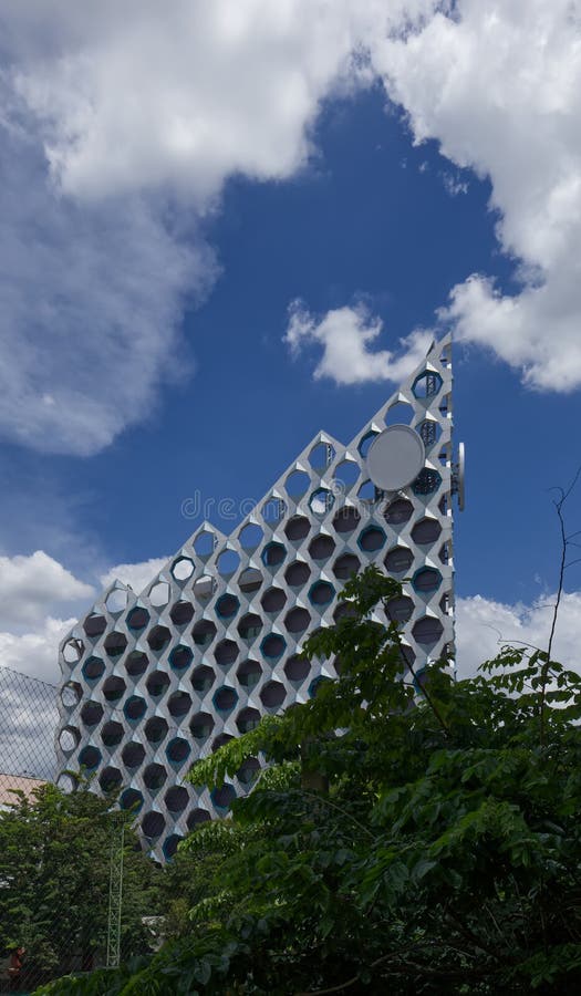 A Modern Building with a Unique Honeycomb Design and Hexagonal Windows ...