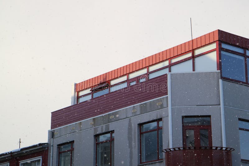 Modern Building in Winter with Snow Coming Down Stock Image - Image of ...