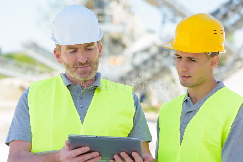 Modern Building Workers Checking Laptop Stock Image - Image of ...