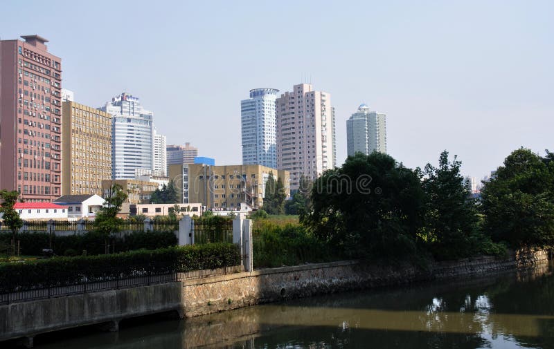 Modern Buildings Along a River Stock Photo - Image of trees, residence ...