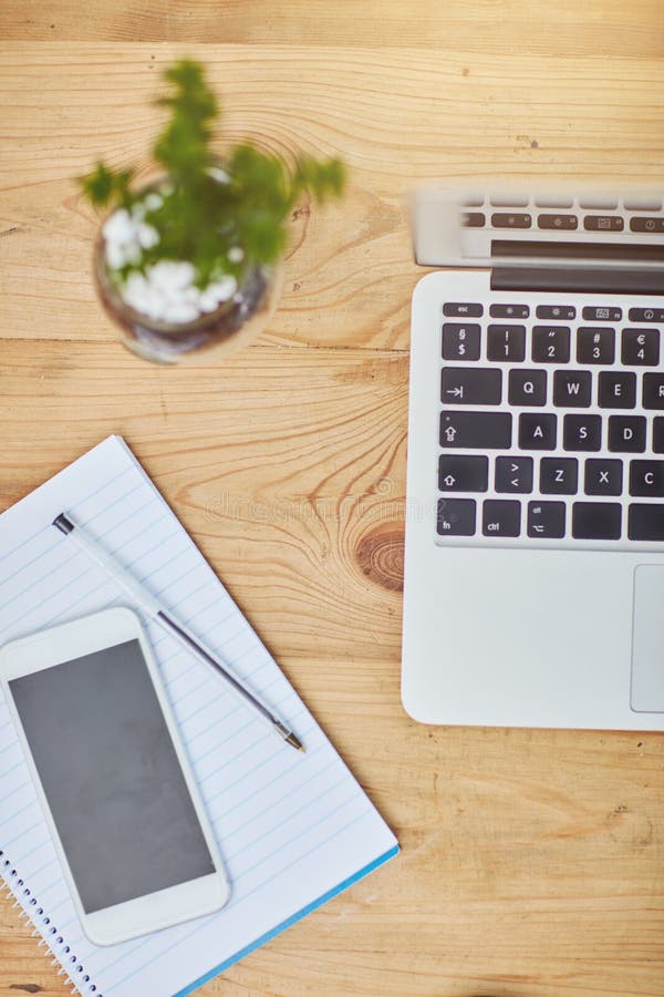 Modern Business Tools. High Angle Shot of a Laptop, Cellphone and ...