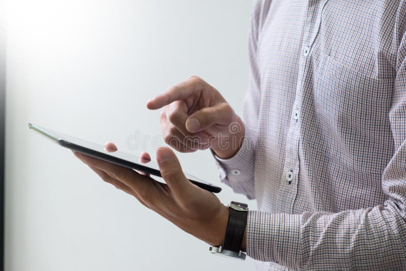 Modern Businessman with Tablet Computer Reading News and Work Re Stock ...