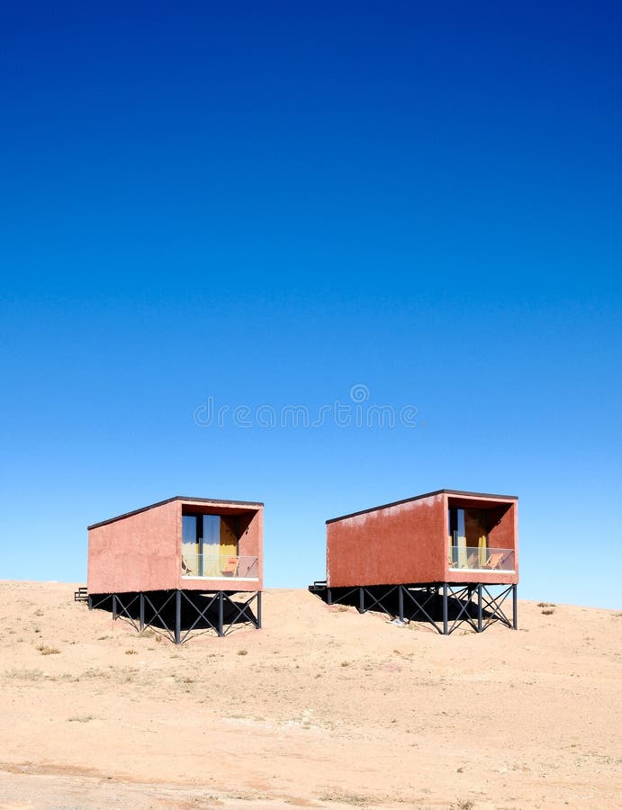 Minimalist Desert Retreat. Row of Modern Cabins in Stark Arid Landscape ...