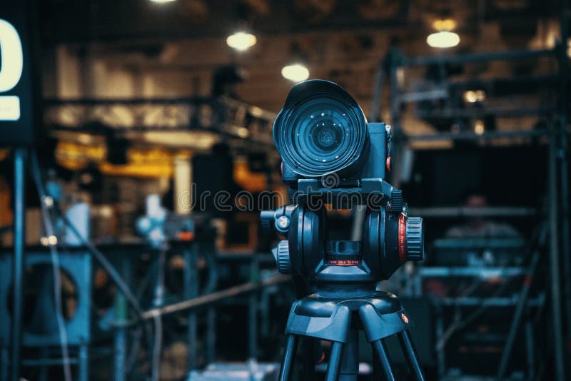 Modern Camera on Tripod in Dark Blue Interior Stock Photo - Image of ...