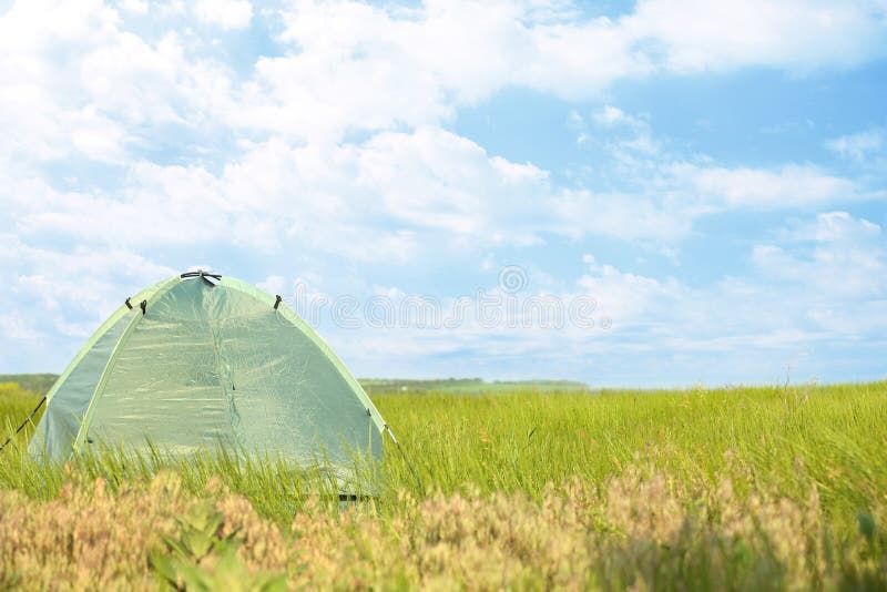 Modern Camping Tent in Green Field on Sunny Day Stock Photo - Image of ...