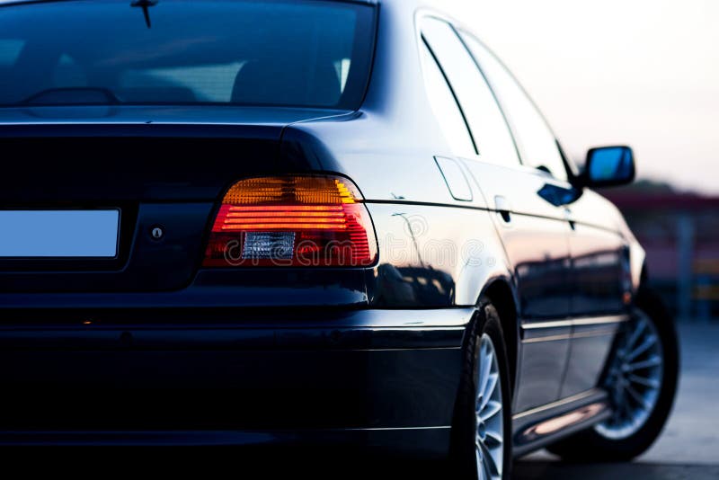 Dark car back corner view stock photo. Image of lamp - 38409012