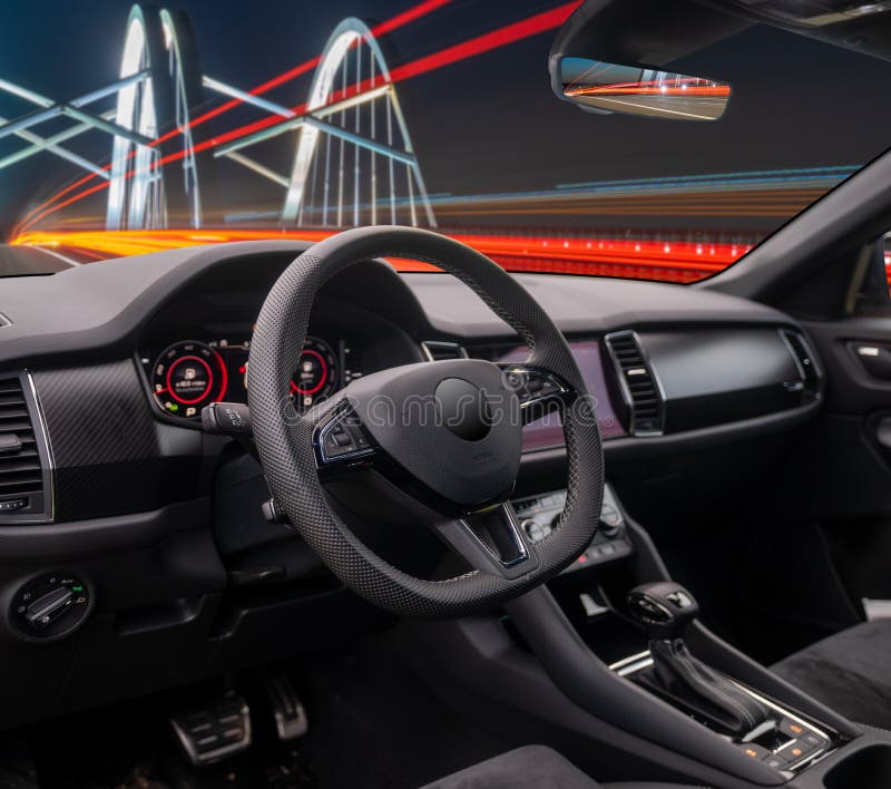 A Modern Car Cockpit Against the Background of an Illuminated Bridge ...