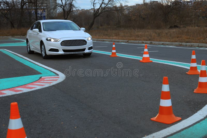 Modern Car on Driving School Test Track with Traffic Cones Stock Image ...