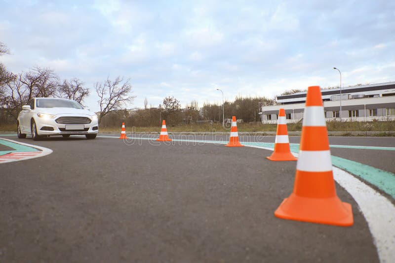 Modern Car on Driving School Test Track with Traffic Cones Stock Photo ...
