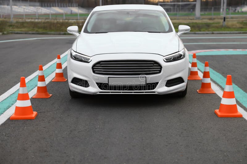 Modern Car on Driving School Test Track with Traffic Cones Stock Photo ...