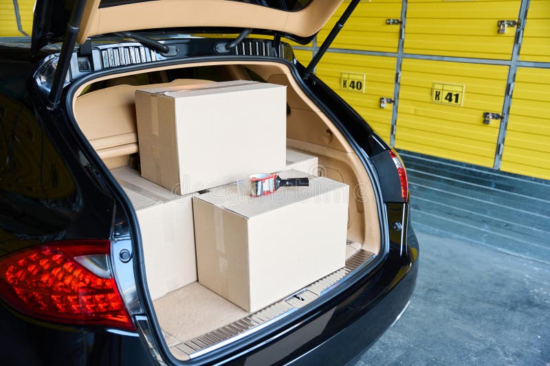 Modern Car with an Open Trunk in a Warehouse Stock Image - Image of ...
