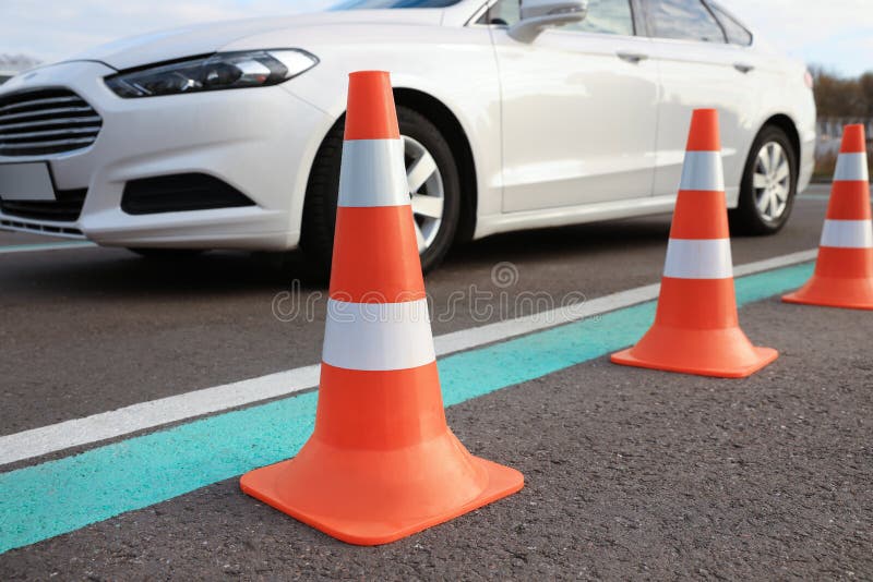 Modern Car at Test Track, Focus on Traffic Cone. Driving School Stock ...
