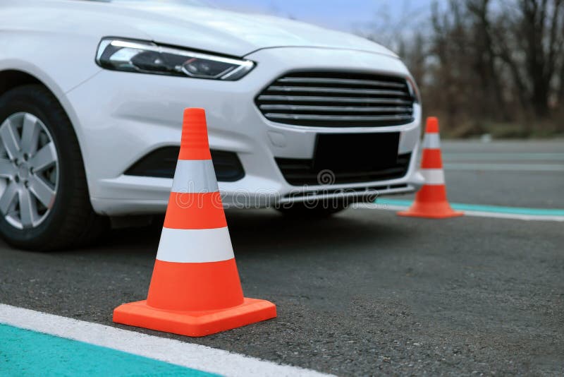 Modern Car at Test Track, Focus on Traffic Cone. Driving School Stock ...