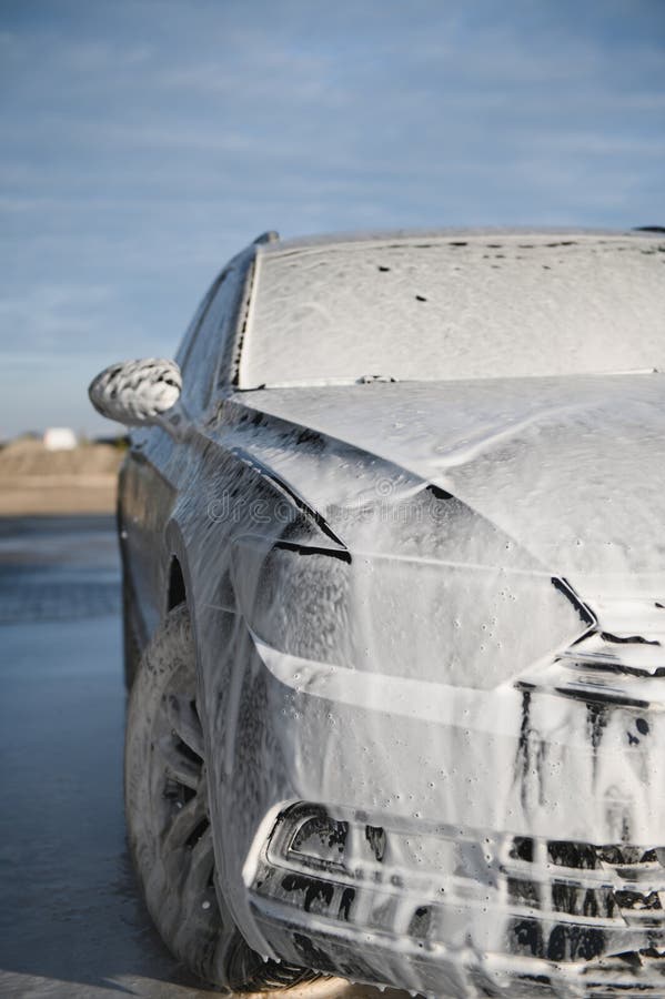 Modern Car with White Foam is Washed at Car Wash. Car Care Stock Image ...