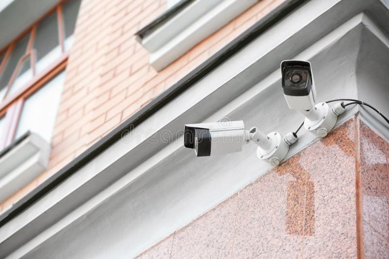 Modern CCTV Cameras on Wall of Building Outdoors Stock Photo - Image of ...