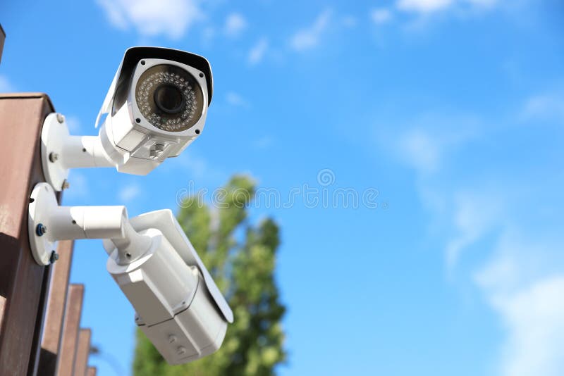 Modern CCTV Security Cameras Against Blue Sky. Stock Photo - Image of ...