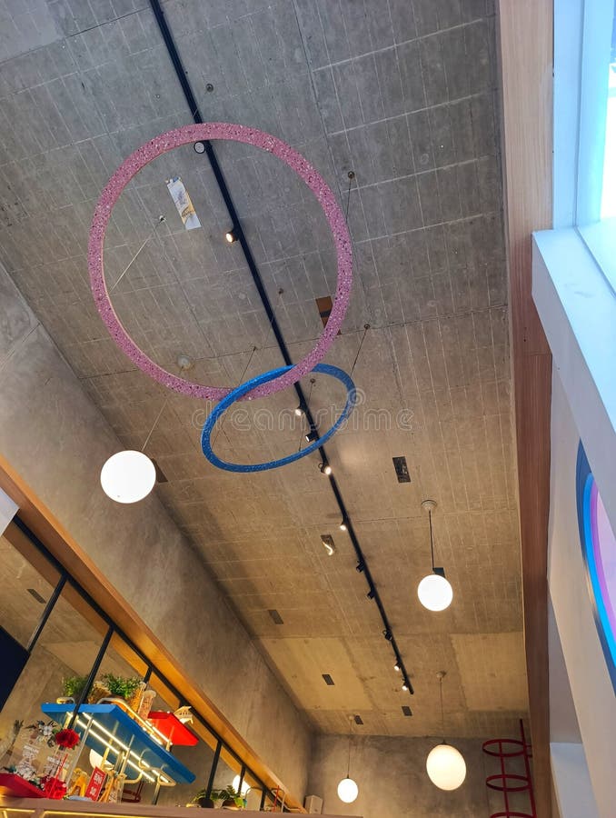 Modern Ceiling Decor with Colorful Rings and Industrial Lighting Stock ...