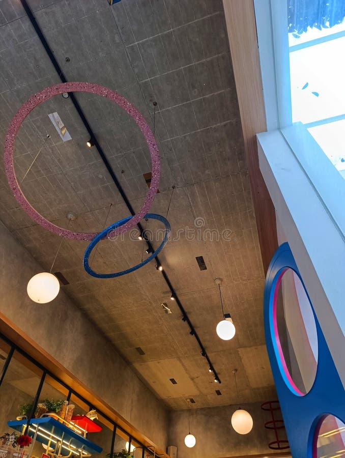 Modern Ceiling Decor with Colorful Rings and Industrial Lighting Stock ...