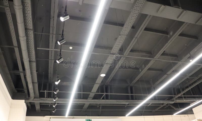 Modern Ceiling Design Features Linear Lighting and Exposed Beams for ...