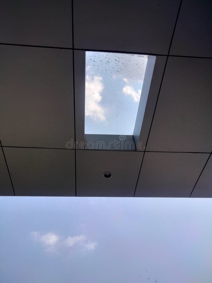 Modern Ceiling Design with a Skylight Window, Revealing Blue Sky and ...