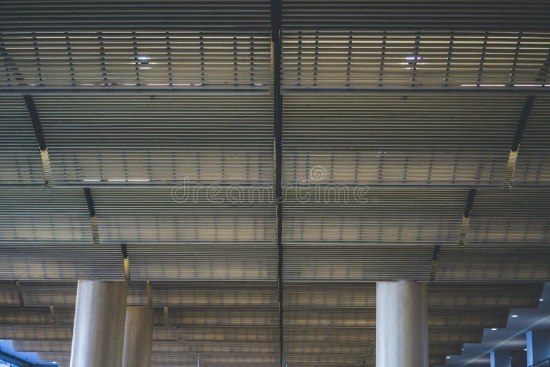 Modern Ceiling with Geometric Lines in a Row Supported by Architectural ...