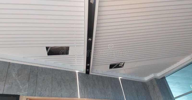 Modern Ceiling Installation with Open Panels and LED Strip Mounts ...