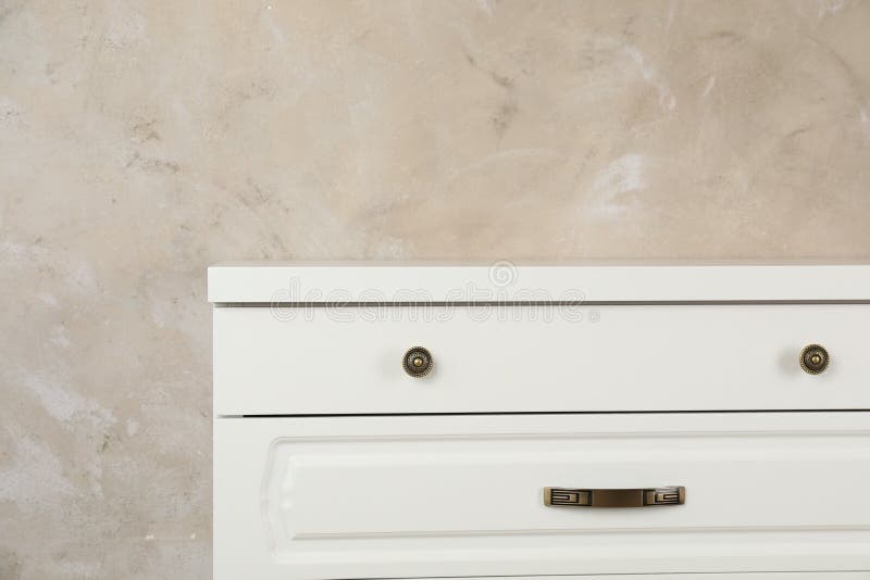 Modern Chest of Drawers Near Beige Wall Stock Image - Image of design ...