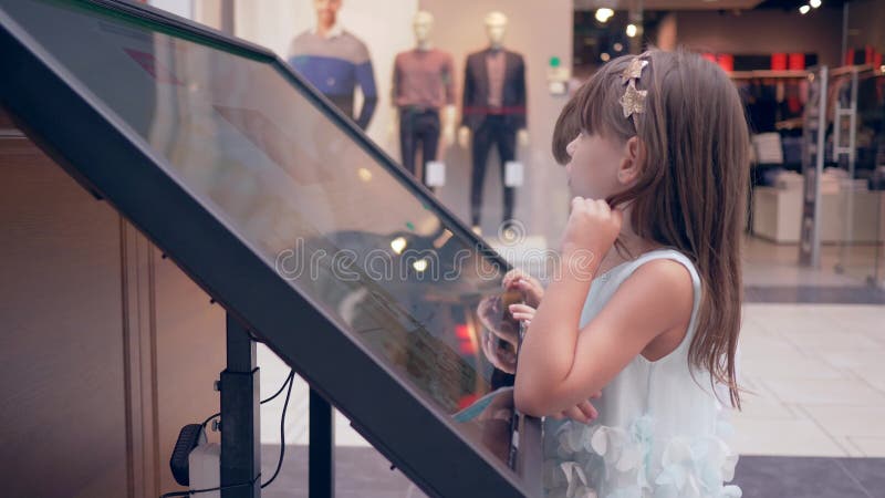 Modern Children Uses Interactive Panel while Making an Online Purchase ...