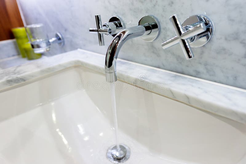 Modern chrome bathroom tap stock image. Image of basin - 288197473
