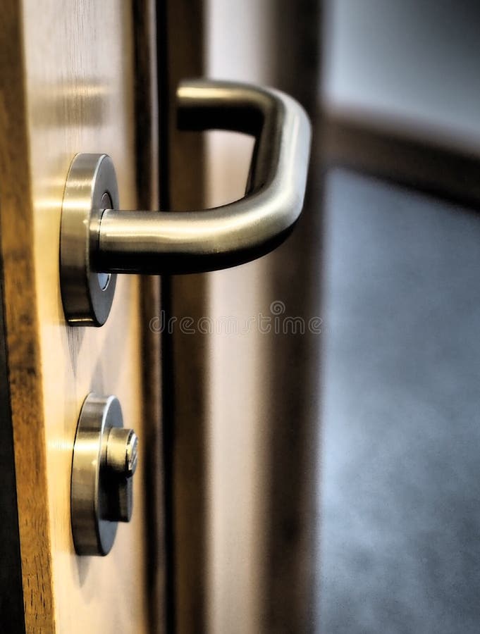 Chrome Door Handle with Key Lock on Wooden Door Stock Image - Image of ...