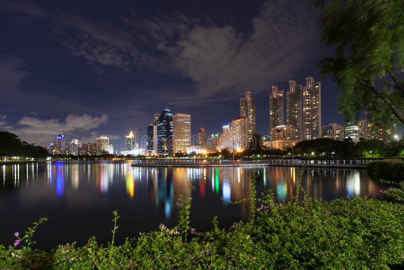 Modern city at night stock image. Image of exposure, pond - 57984939