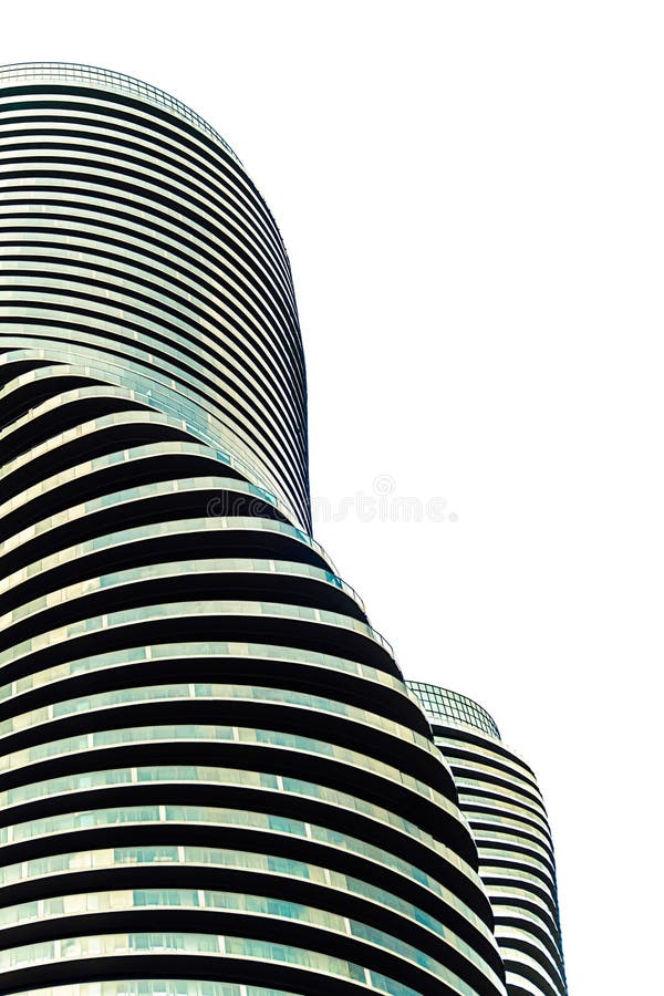 Modern Cityscape Featuring a Tall Building with Curved Edifices ...