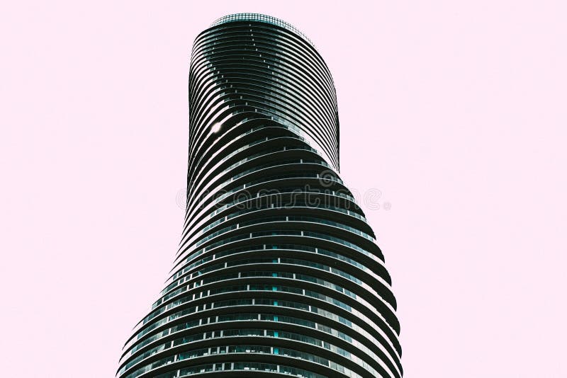 Modern Cityscape Featuring a Tall Building with Curved Edifices ...