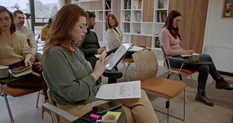 Engaged and Attentive Teenage Students Listening To Their Teacher in a ...