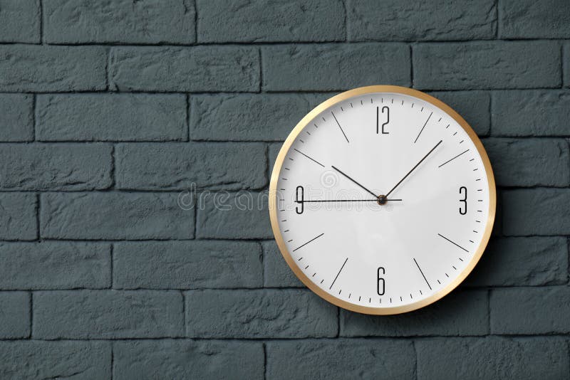Modern clock on brick wall stock photo. Image of measurement - 121006458
