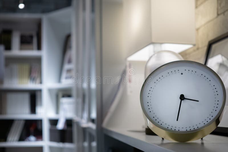 Modern Clock in the Living Room with Book Shelves and Lamp Stock Image ...