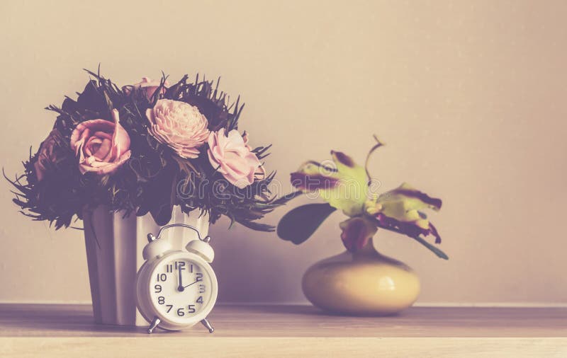 Modern Clock on Wood Table with Flower Pot , Vintage Process Stock ...
