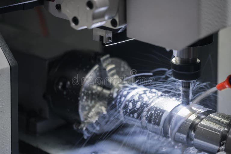 A Modern Cnc Machine Produces a Piece of Metal Part Using the Milling ...