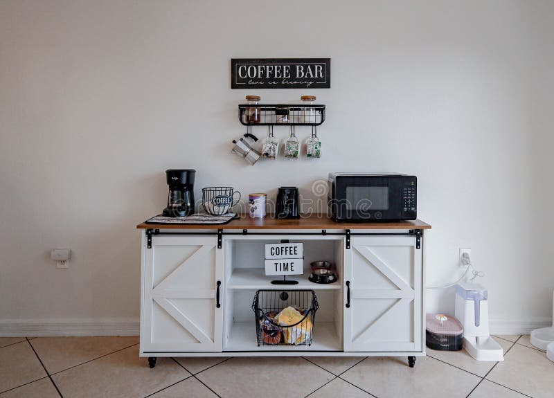Modern Coffee Bar Setup Featuring a Coffee Maker, Microwave, and ...