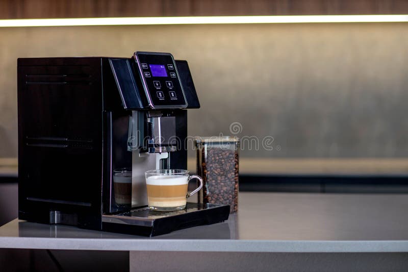 Modern Coffee Machine with Glass Cup of Latte in Kitchen Stock Photo ...