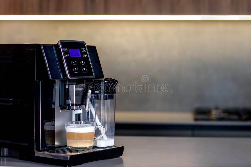 Modern Coffee Machine with Glass Cup of Latte in Kitchen Stock Photo ...