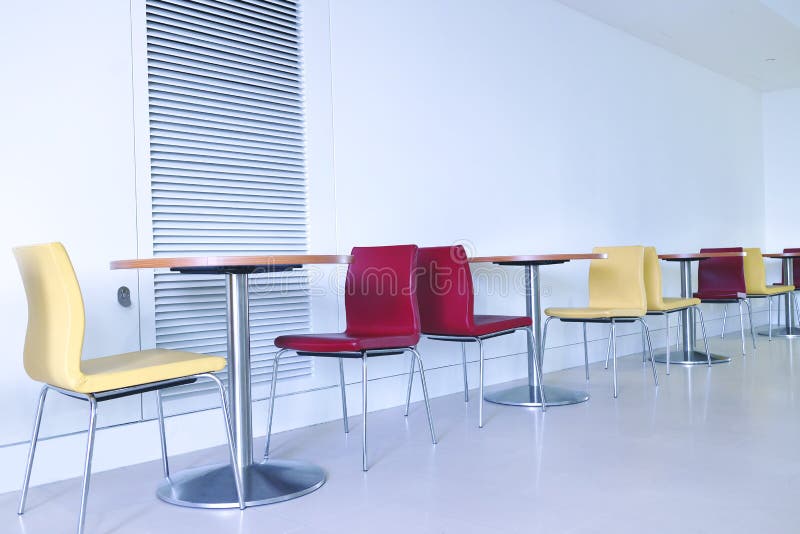 Modern Colourful Chairs and Tables in a Cafeteria Stock Image - Image ...