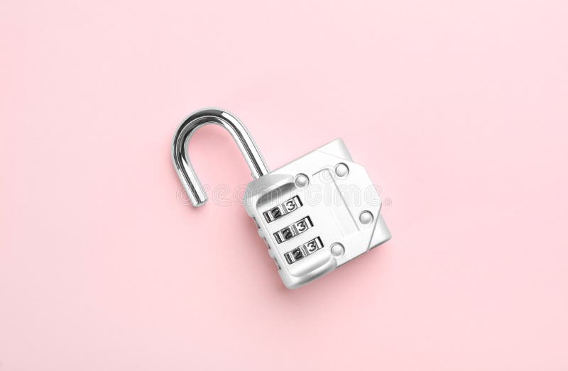Modern Combination Lock on Pink Background, Top View Stock Image ...