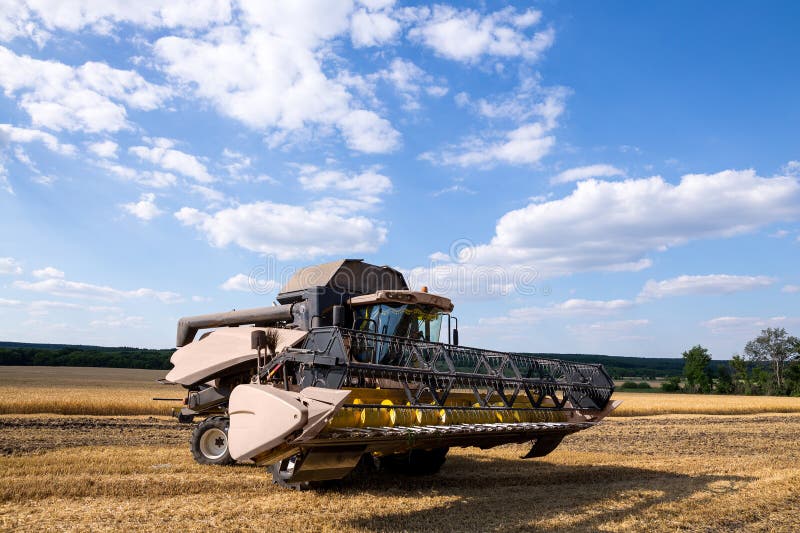 A Modern Combine Harvester Stands on the Field during Harvesting Withe ...