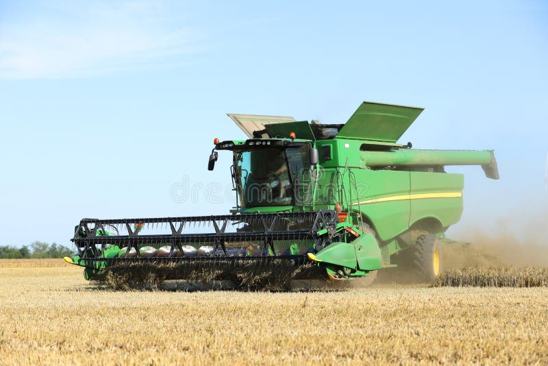 Modern Combine Harvester Working in Agricultural Field Editorial ...